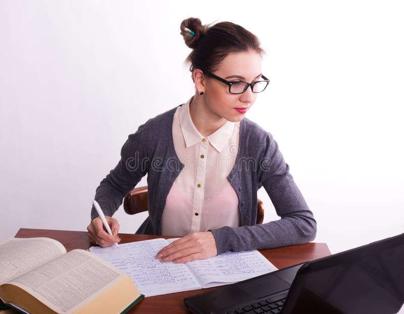 Young Beautiful Female Teacher Sitting at a Table Stock Photo - Image ...