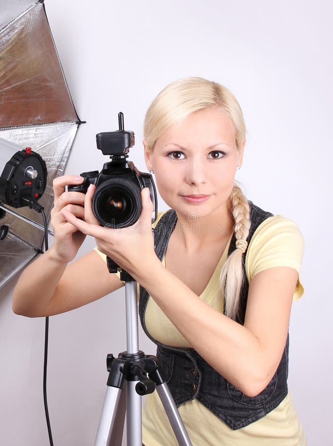Young Beautiful Girl with the Camera in Studio Stock Photo - Image of ...