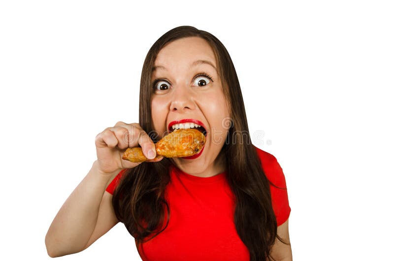 Young Beautiful Girl Eats a Chicken Leg, Isolated on a White Background ...