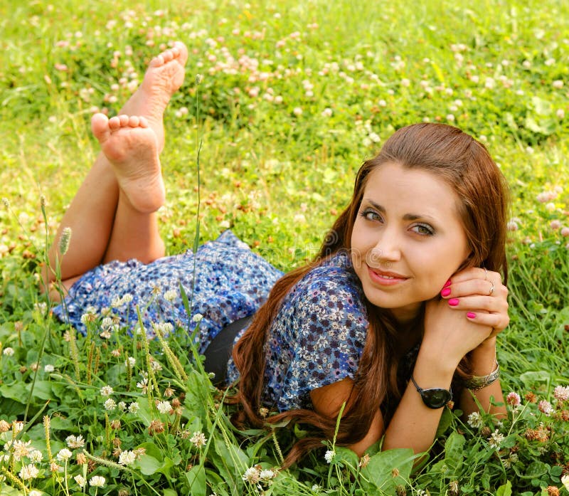 Young Beautiful Girl Lays on a Grass Stock Image - Image of caucasian ...
