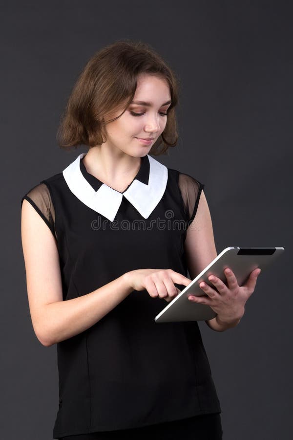 Young Beautiful Girl Looking on Touch Pad Stock Photo - Image of ...