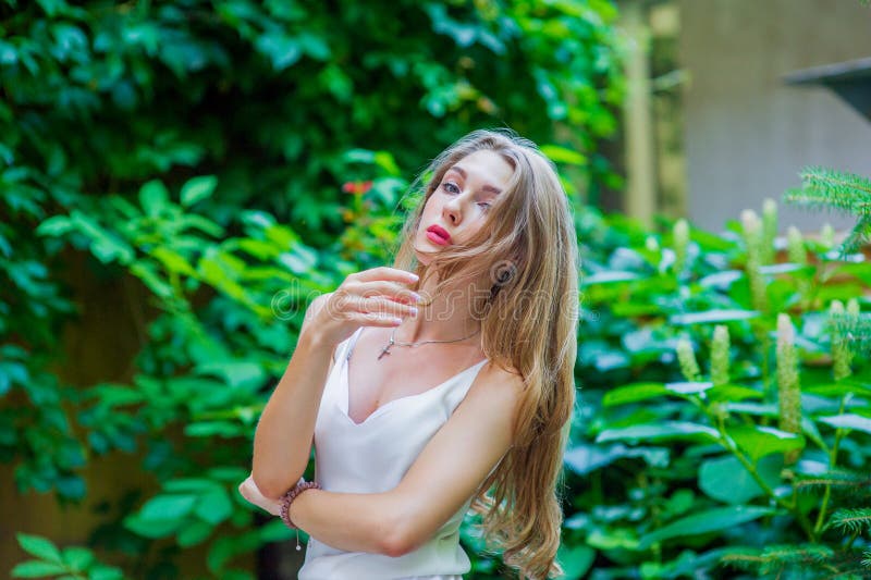 Young Beautiful Girl Posing Outdoor Wearing Fashionable White Dress Summer Style Stock Image