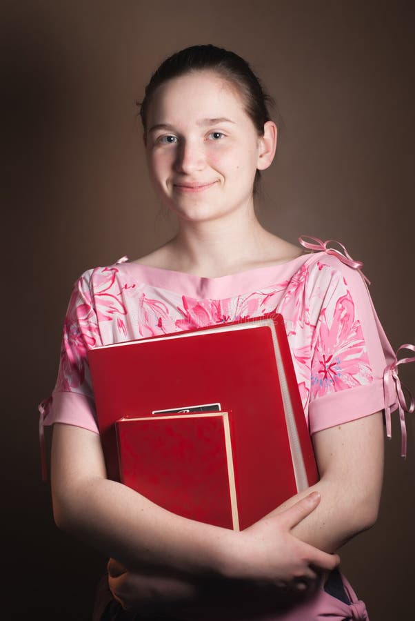 Young Beautiful Girl with a Red Book Stock Photo - Image of people ...