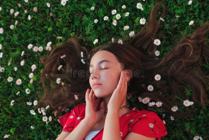 Young Beautiful Girl Resting on Fresh Spring Grass Stock Image - Image ...