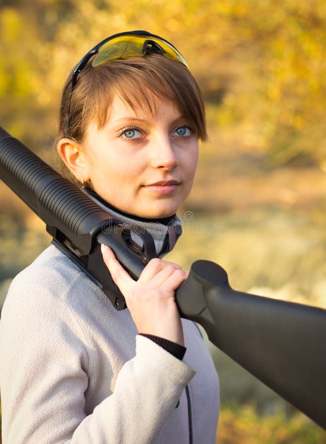 Young Beautiful Girl with a Shotgun Stock Photo - Image of forces, face ...