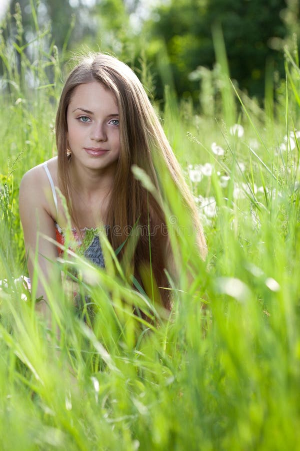 Young Female Lying on Grass Stock Image - Image of girl, pretty: 25662267