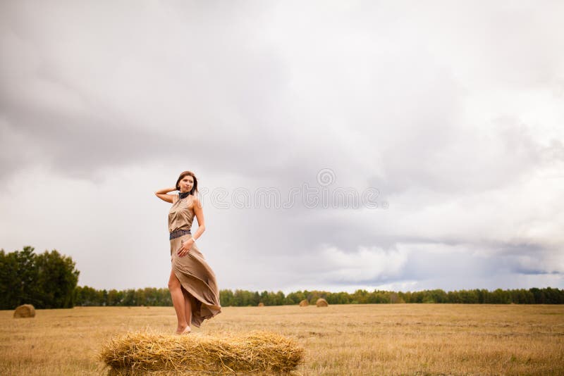 Young Beautiful Girl Standing on the Haystack Stock Image - Image of ...