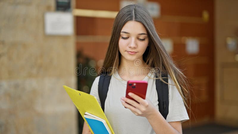 Young Beautiful Girl Student Using Smartphone with Serious Face at ...