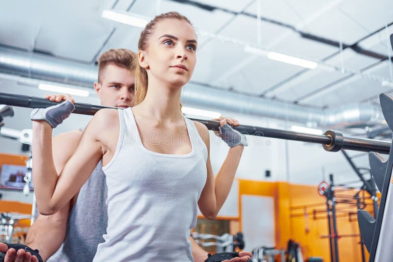 Young, Beautiful Girl Training with the Coach in the Gym. Stock Image ...