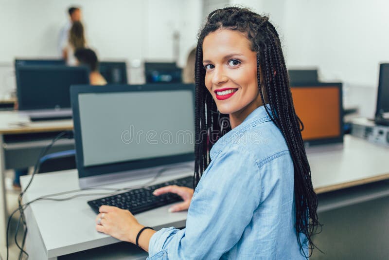 Beautiful Girl Working on a Computer in a Classroom Stock Photo - Image ...