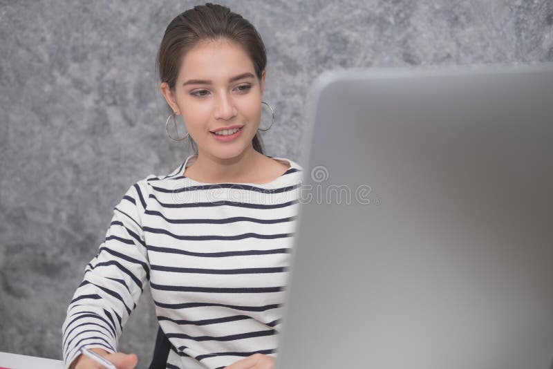 Young Beautiful Girl Working on the Laptop at the Office Stock Photo ...