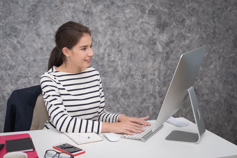 Young Beautiful Girl Working on the Laptop at the Office Stock Image ...