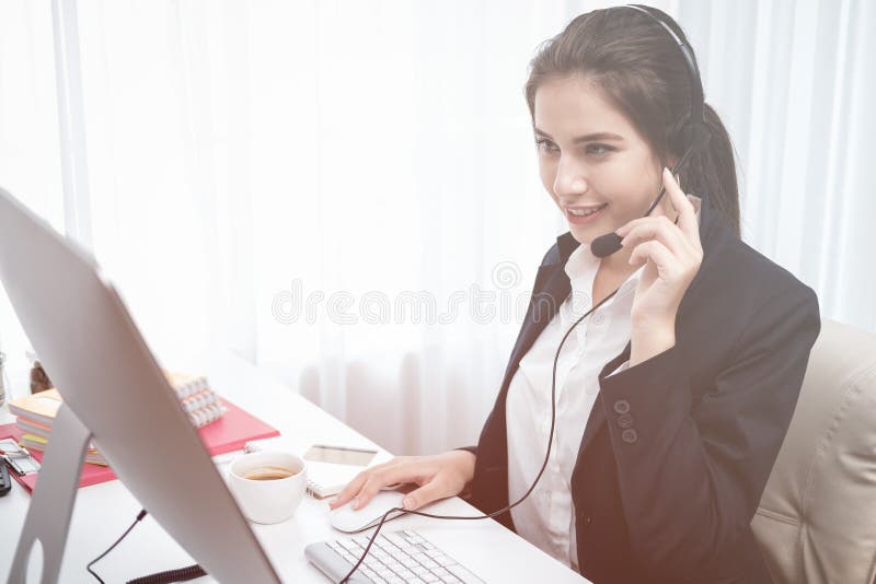 Young Beautiful Girl Working at a Laptop in a Small Medium Enterprise ...