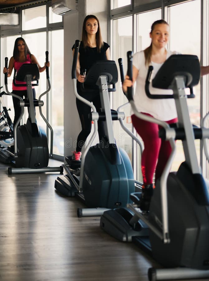 Fitness Girl Burning Calories on the Treadmill. Beautiful Young ...