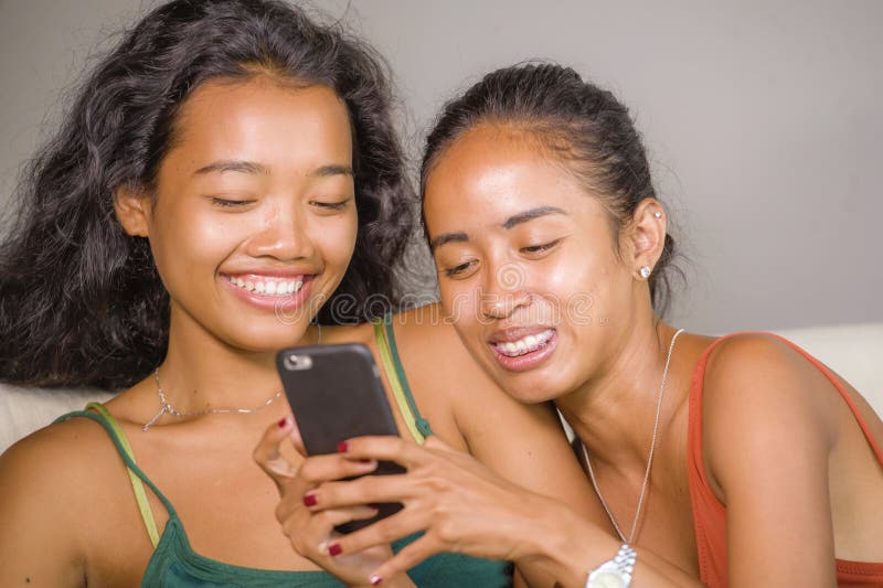 Young Beautiful And Happy Asian Girlfriends Couple Or Sisters Enjoying