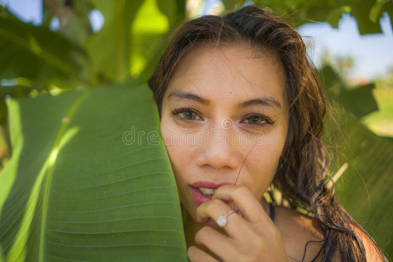 Young Beautiful And Happy Asian Indonesian Woman In Bikini Posing