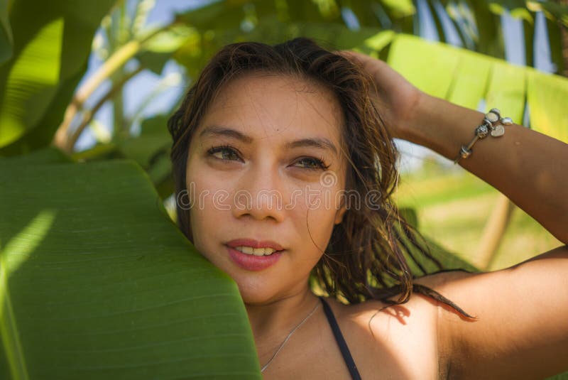 Young Beautiful And Happy Asian Indonesian Woman In Bikini Posing