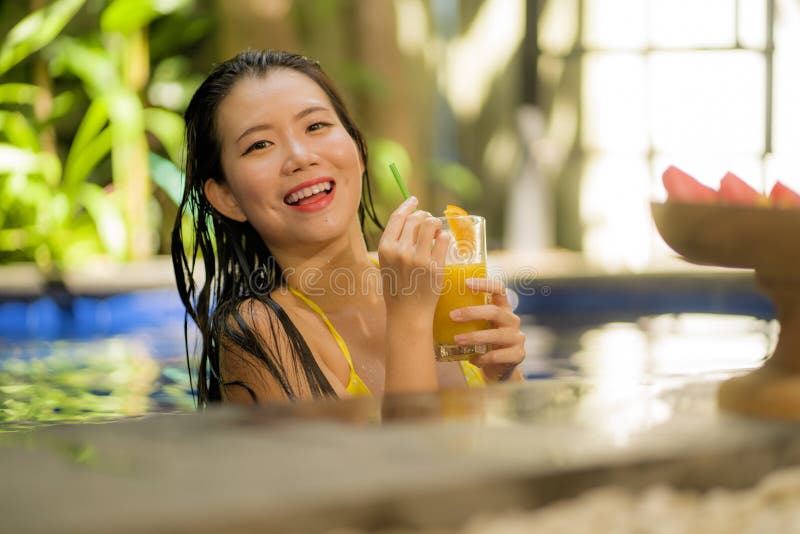 Young Beautiful And Happy Asian Korean Woman In Bikini Enjoying