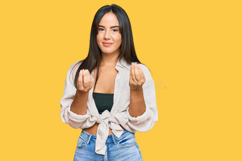 Young Beautiful Hispanic Girl Wearing Casual Clothes Doing Money