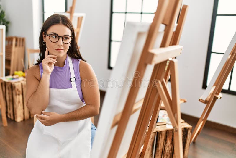 Young Beautiful Hispanic Woman Artist Looking Draw with Doubt ...