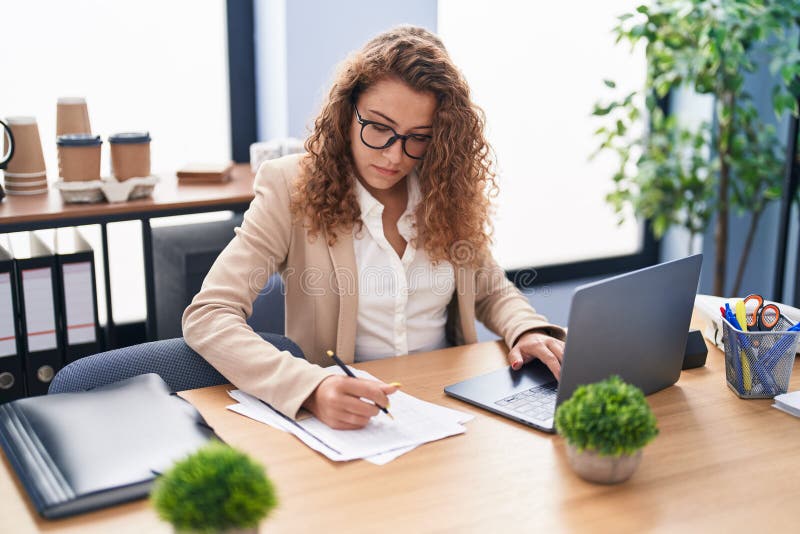 Young Beautiful Hispanic Woman Business Worker Using Laptop Writing on ...