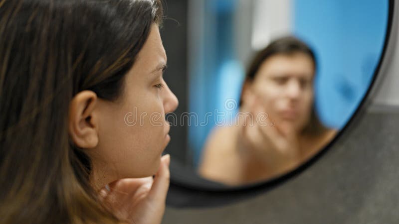 Young Beautiful Hispanic Woman Looking for Pimples at the Mirror in the ...