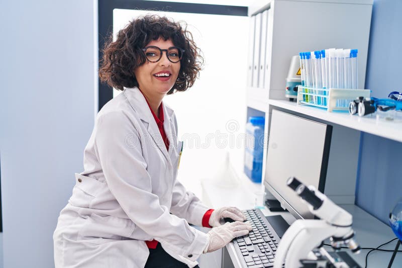 Young Beautiful Hispanic Woman Scientist Smiling Confident Using ...
