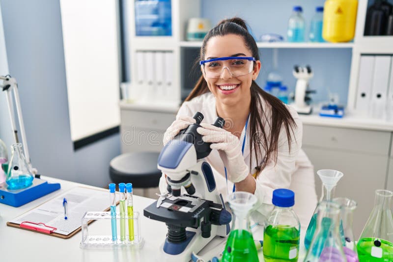Young Beautiful Hispanic Woman Scientist Smiling Confident Using ...