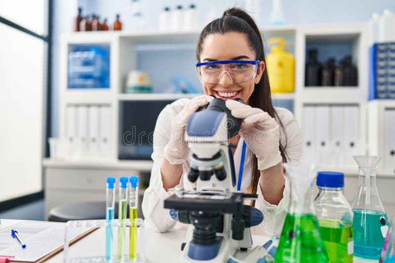 Young Beautiful Hispanic Woman Scientist Smiling Confident Using ...