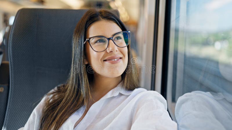 Young Beautiful Hispanic Woman Smiling Happy Looking through the Window ...