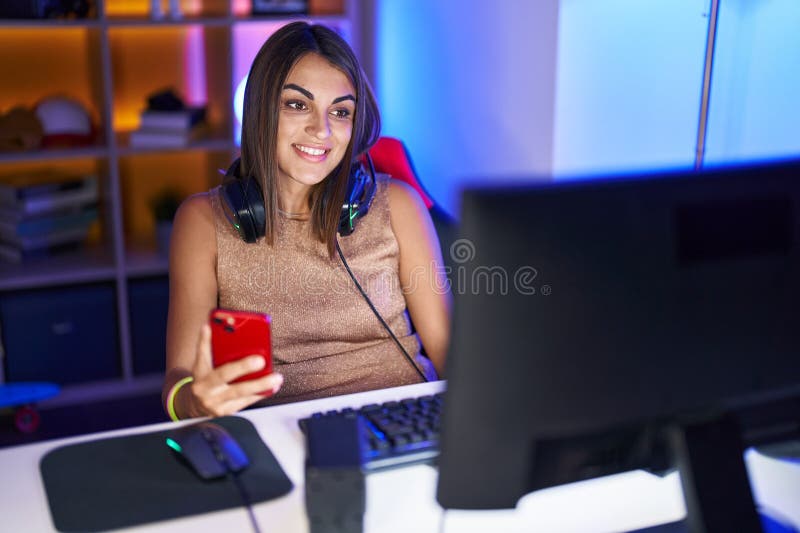 Young Beautiful Hispanic Woman Streamer Using Computer and Smartphone ...