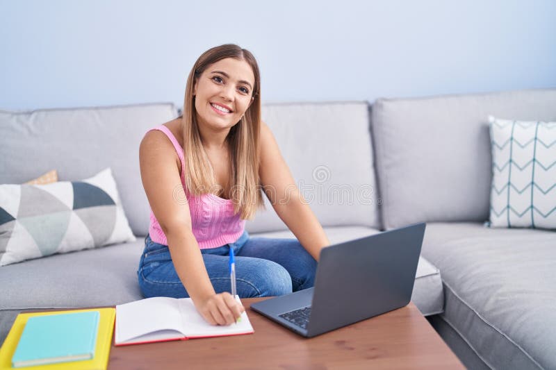 Young Beautiful Hispanic Woman Student Sitting on Sofa Writing on ...