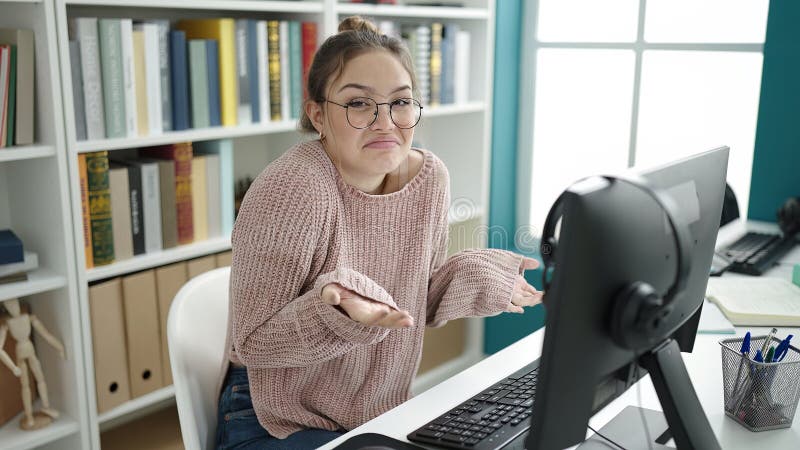 Young Beautiful Hispanic Woman Student Using Computer Doing I Dont Know ...