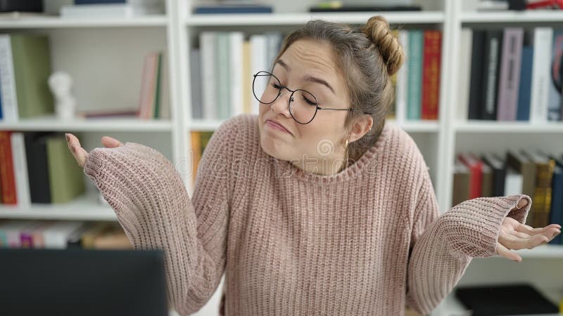 Young Beautiful Hispanic Woman Student Using Computer Doing I Dont Know ...