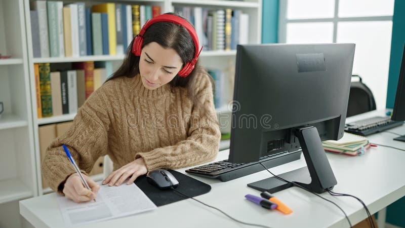 Young Beautiful Hispanic Woman Student Using Computer and Headphones ...