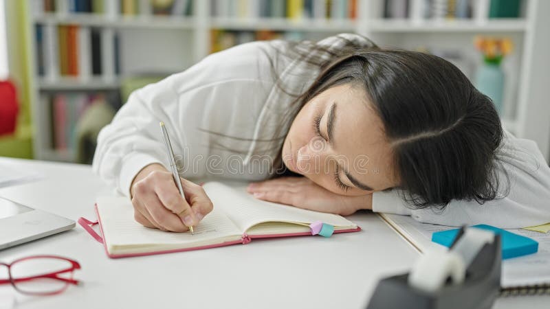 Young Beautiful Hispanic Woman Student Writing Notes Tired at ...