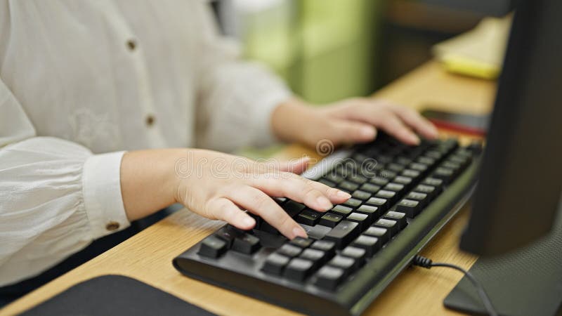 Young Beautiful Hispanic Woman Using Computer Typing on Keyboard at the ...