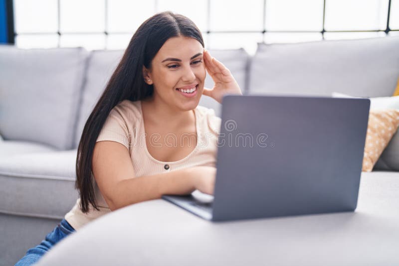 Young Beautiful Hispanic Woman Using Laptop Sitting on Floor at Home ...