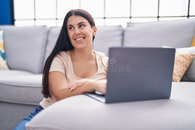 Young Beautiful Hispanic Woman Using Laptop Sitting on Floor at Home ...