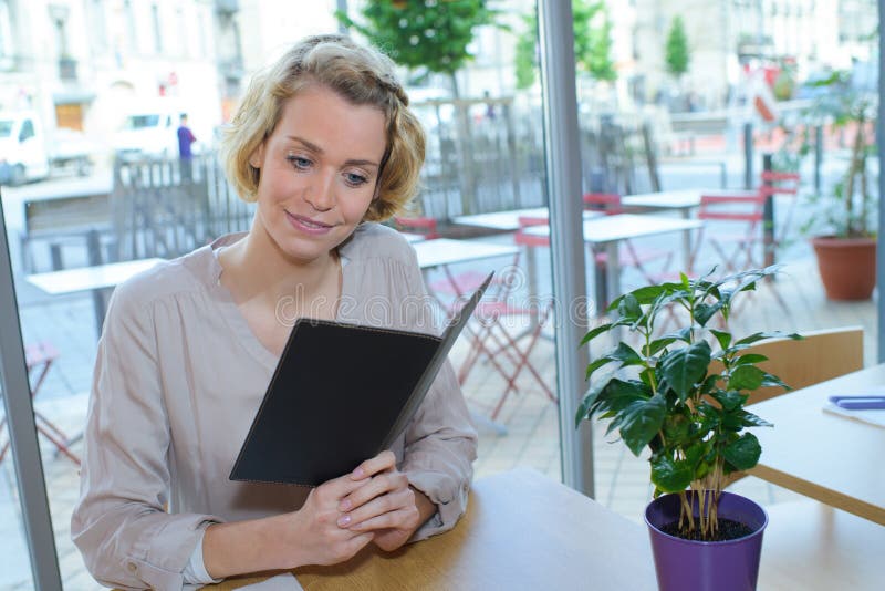 Young and Beautiful Lady Checking Menu in Restaurant Stock Photo ...