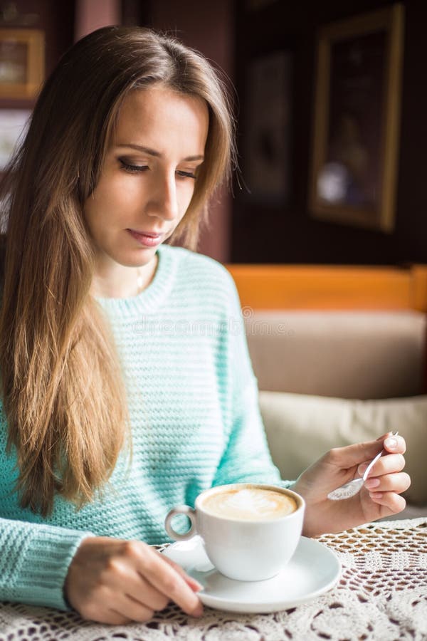 Young Beautiful Lady Having Coffee Break In The Cafe Stock Image