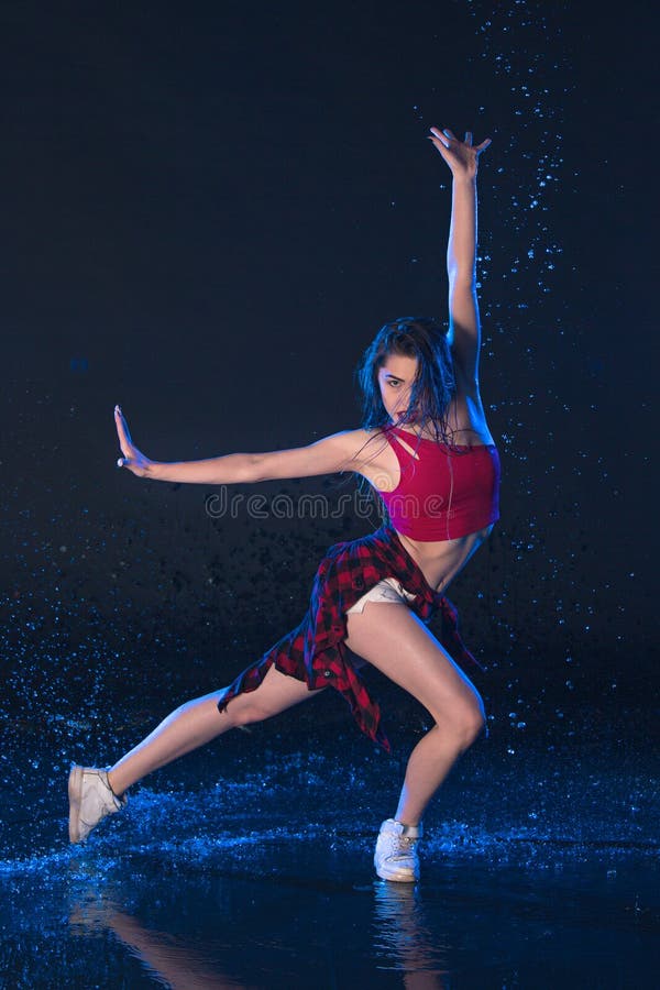 The Young Beautiful Modern Dancer Dancing Under Water Drops Stock Photo ...