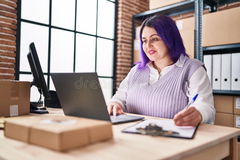 Young Beautiful Plus Size Woman Ecommerce Business Worker Using ...