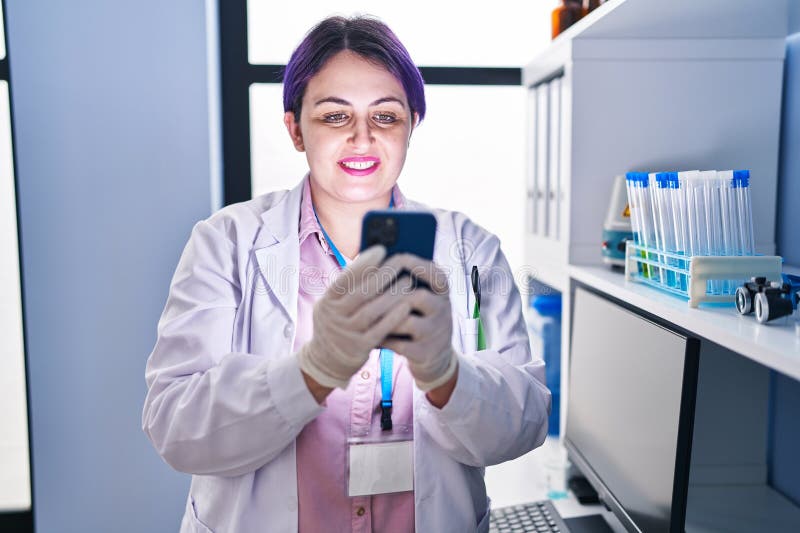 Young Beautiful Plus Size Woman Scientist Smiling Confident Using ...