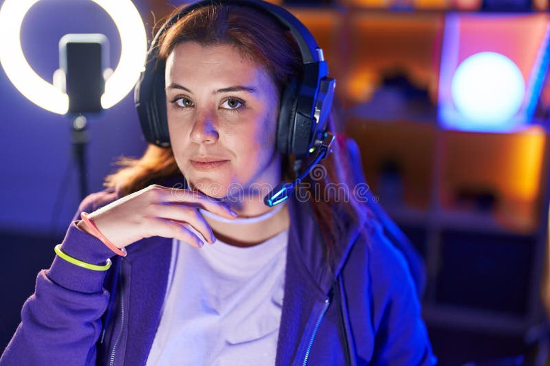 Young Beautiful Plus Size Woman Streamer Sitting on Table with Relaxed ...