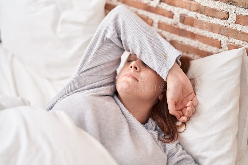 Young Beautiful Plus Size Woman Stressed Lying on Bed at Bedroom Stock ...