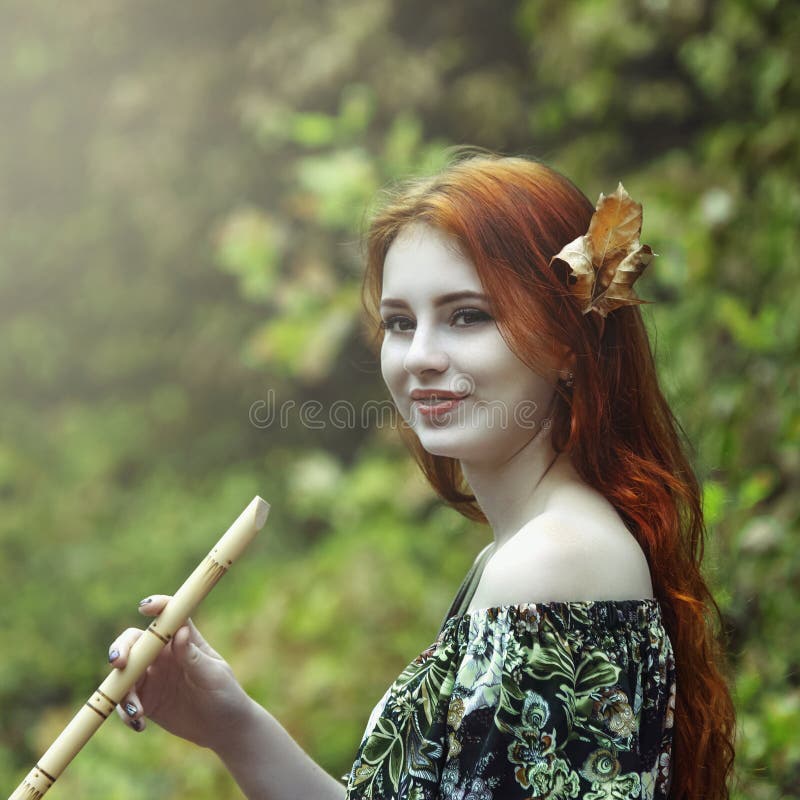 Young Beautiful Red-haired Girl Lonely Sits In Church Praying To Stock ...