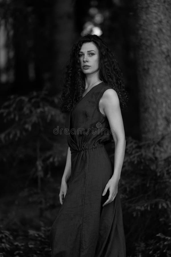 Young Beautiful Skinny Brunette Posing In A Forest Grove Young