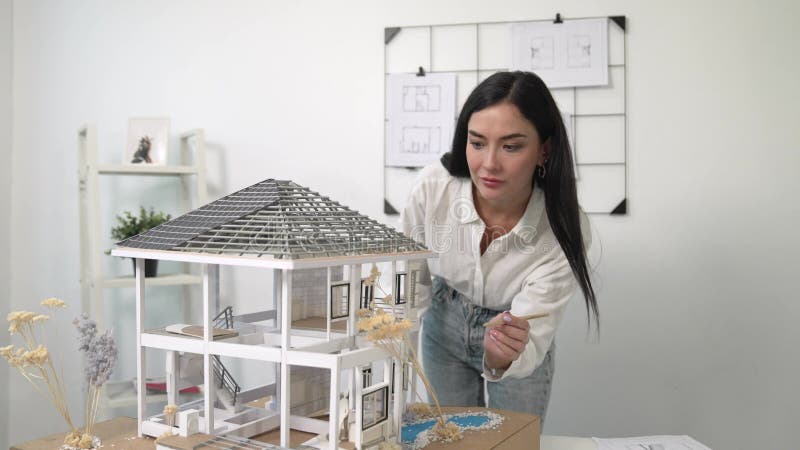 Young Beautiful Smart Engineer Measure House Model by Using Pencil. Immaculate. Stock Footage ...