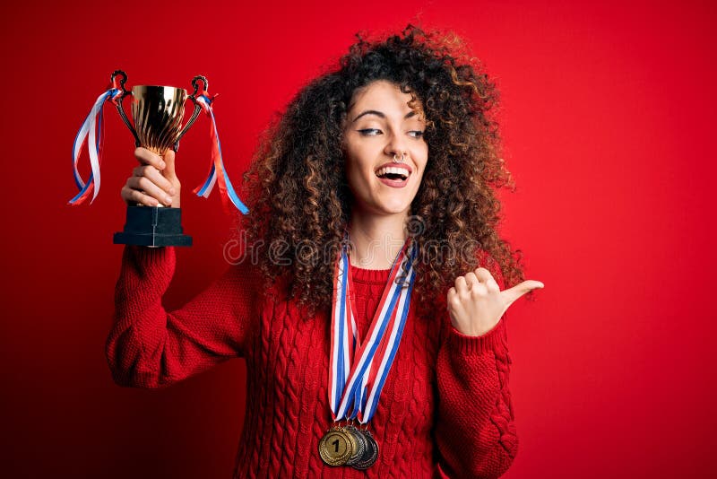 Young Beautiful Successful Woman with Curly Hair and Piercing Holding ... Young Beautiful Successful Woman with Curly Hair and Piercing Holding ...